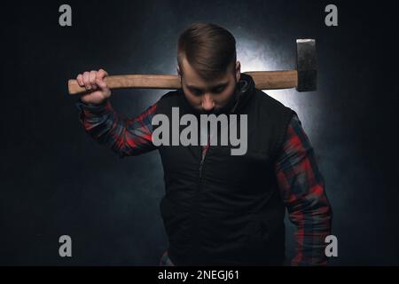 Scary axeman. Angry maniac with axe Stock Photo - Alamy