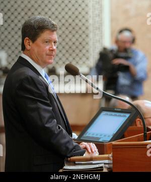 House Speaker Greg Stumbo, D-Prestonsburg, whispers to Rep. Fred Nesler ...