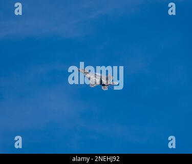 A F-22 Raptor shows off its skills in an aerial acrobatic demonstration ...