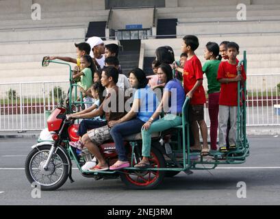 Overloaded Tricycle in Manila, Philippines Stock Photo - Alamy
