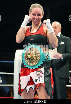 WBC Super-featherweight champion Olivia Gerula (red shorts) from ...