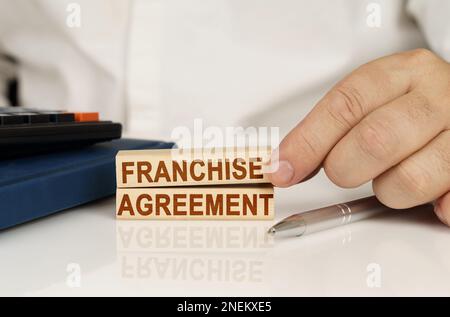 Franchising concept in business and finance. Word typography on wooden ...