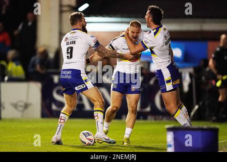 Warrington Wolves' Matt Dufty (centre) on the ball during the Betfred ...