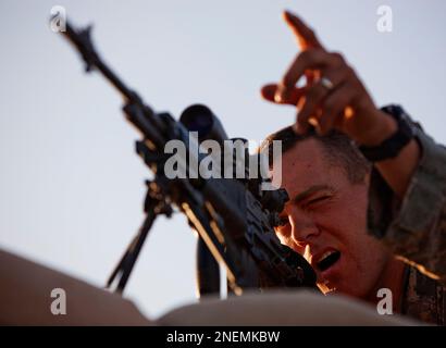 A sniper from the U.S. Army 10th Special Forces Group (Airborne) rests ...