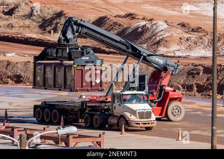 A reachstacker container handler removes a filled and washed container ...