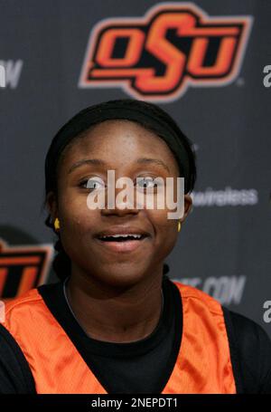 Oklahoma State guard Andrea Riley, right, collides with Texas Tech ...