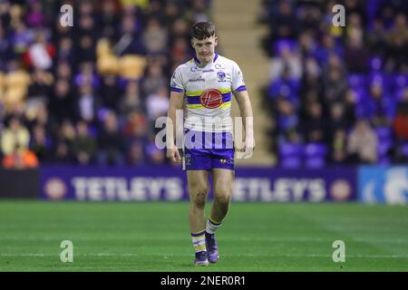 Josh Thewlis #2 of Warrington Wolves stretches during pre match warm up ...