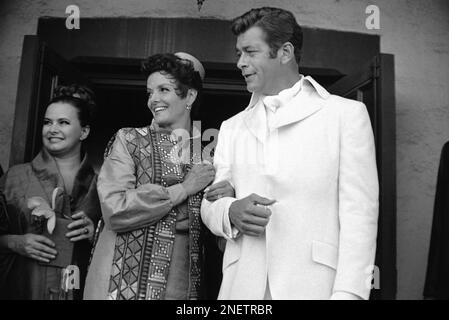 Actress Jane Russell and her bridegroom, actor Roger Barrett, sit in a ...