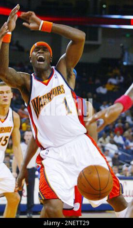 Golden State Warriors' Stephen Jackson, left, celebrates in the closing ...