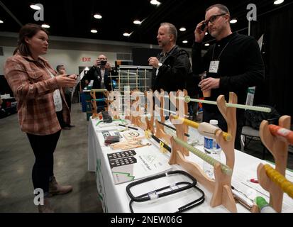 Vancouver, Canada. 16th Feb, 2023. People look at some wall panel ...