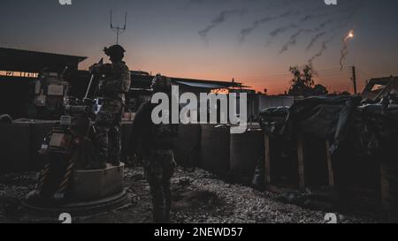 Coalition Forces fire a 120mm illumination mortar round during a live ...