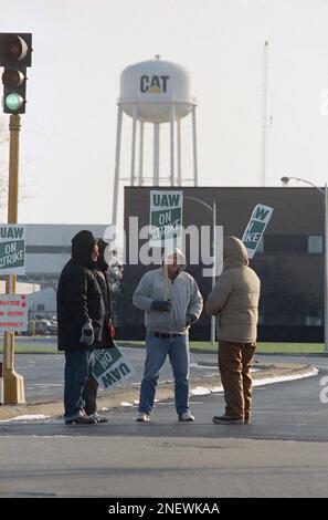 UAW members walk out on strike and work the picket line at the ...