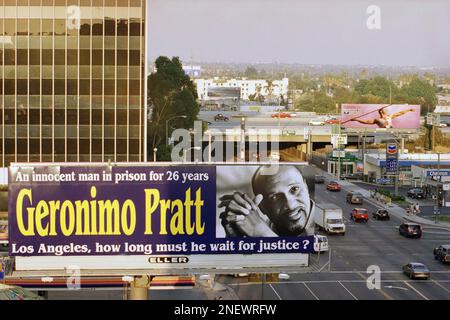 The Los Angeles driving public passes a billboard of jailed former ...