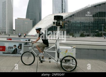 Google employee Arthur Poirier, on a camera-equiped tricycle, records ...
