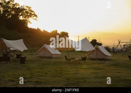 White tents in a green field Stock Photo - Alamy