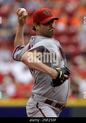 Arizona Diamondbacks starter Doug Davis wipes his face after walking ...