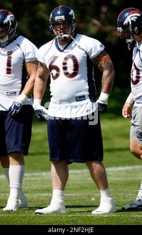 Denver Broncos guard Matt McChesney (60) listens to offensive line ...