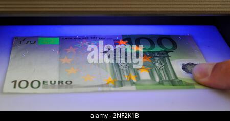 Euro bank note in UV light Stock Photo - Alamy