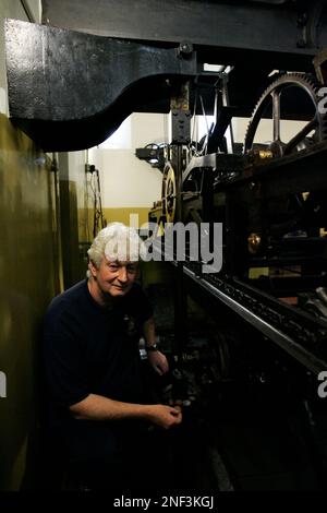 The mechanism inside the tower clock with a pendulum Stock Photo - Alamy