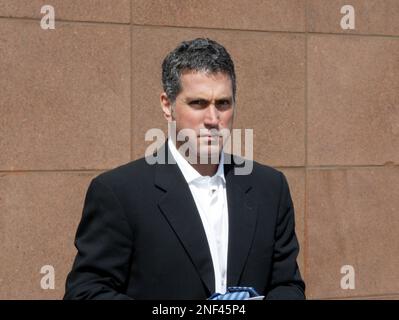 Beverly Hills hedge fund manager Bradley L. Ruderman, right, holds his ...
