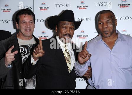 Chuck Zito poses with former heavyweight boxing champions Joe Frazier ...