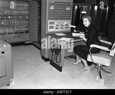 Human computer with IBM 704 in 1959 Stock Photo - Alamy