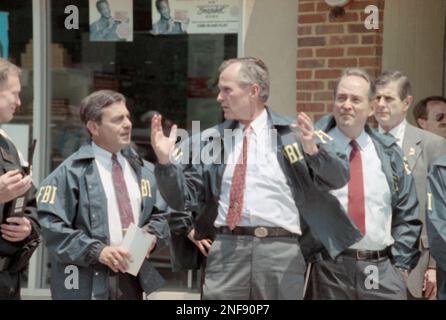 President George Bush responds to an explosion while touring Hogan's ...