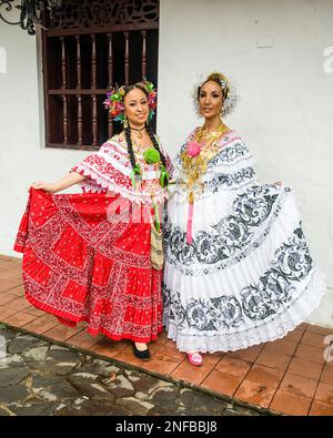 Two Panamanian women wearing the colorful traditional pollera, the ...