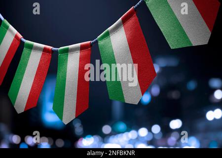 A small Hungary flag on an abstract blurry background Stock Photo - Alamy