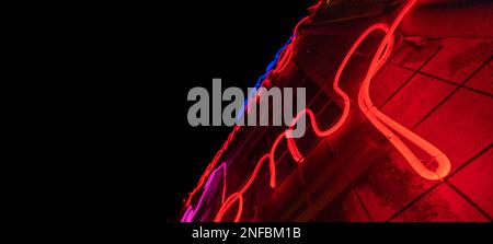 Illuminated letters and words made with neon lights and blue LEDs of ...