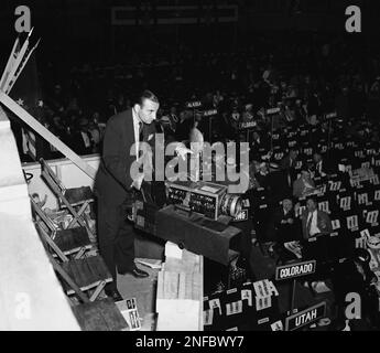 United States: 1936 A press photographer aims his flash camera Stock ...