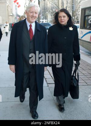 Liberal leadership candidate Bob Rae kisses his wife Arlene Perley Rae ...