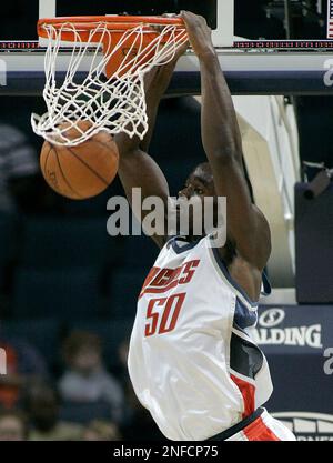 Charlotte Bobcats' Emeka Okafor (50) is guarded by Philadelphia 76ers ...