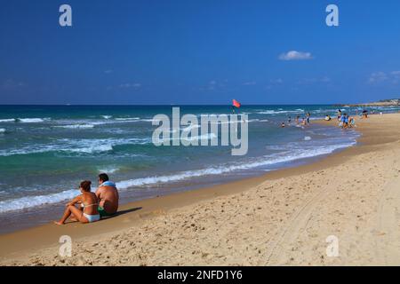HAIFA, ISRAEL - NOVEMBER 1, 2022: People visit sandy Dado Beach in ...