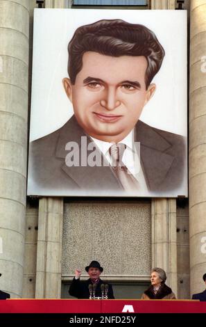 Romanian leader Nicolae Ceausescu addresses the public from the balcony ...