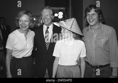 President Jimmy Carter and his son, Chip Carter, walk the dormant ...