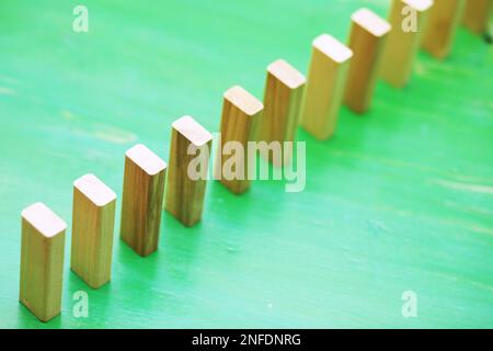 Stick wood block standing on stacked square wood blocks, abstract ...