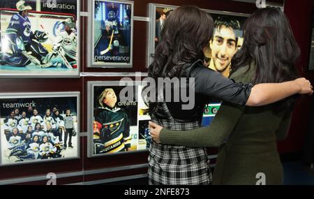 Vancouver Canucks defenceman Luc Bourdon's picture is projected on the ...