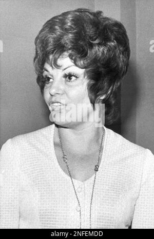 Mrs. Virginia Graham, 37, talks with her attorney, Robert Steinberg, at ...