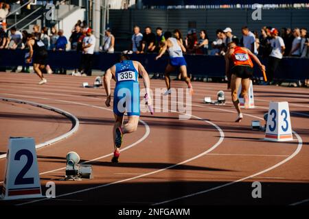 start running relay race for men in athletics competition Stock Photo ...