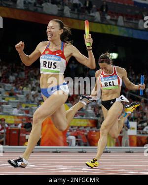 Belgium's Kim Gevaert, right, celebrates winning the gold medal in the ...