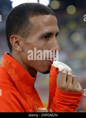 Gold medalist Rashid Ramzi of Bahrain celebrates his medal during the ...