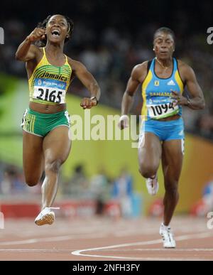 Bahamas' Debbie Ferguson-McKenzie crosses the finish line to take the ...