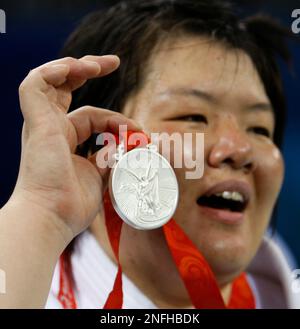 Silver medalist Maki Tsukada of Japan stands at the medals ceremony of ...