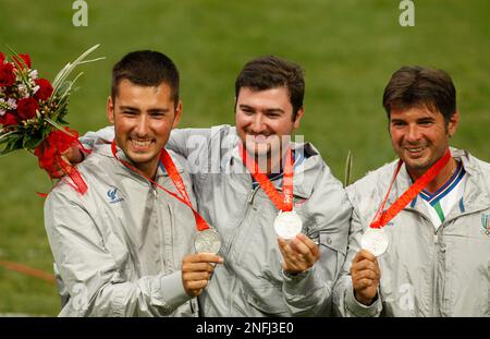 Italy's Ilario Di Buo, left, and Mauro Nespoli cheer after a successful ...
