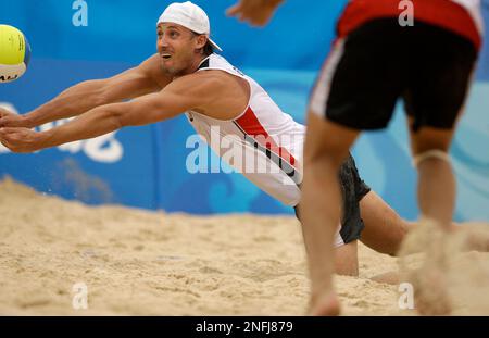Austria's Florian Gosch dives for a ball against China in a beach ...