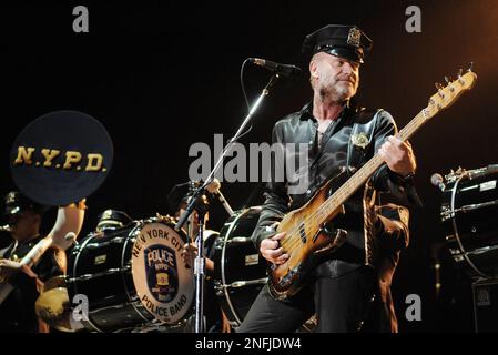 Lead vocalist and bassist Sting, center, and his band The Police are ...