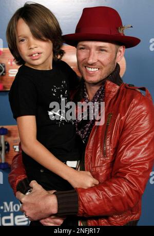 Singer Scott Weiland, right, and his son Noah Weiland pose on the press ...