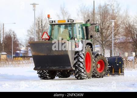 Tractor spreading grit with ATI 18 gritter and ploughing snow off ...