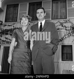 Actor Louis Jourdan and his wife, Berthe Fredrique, look over a ...